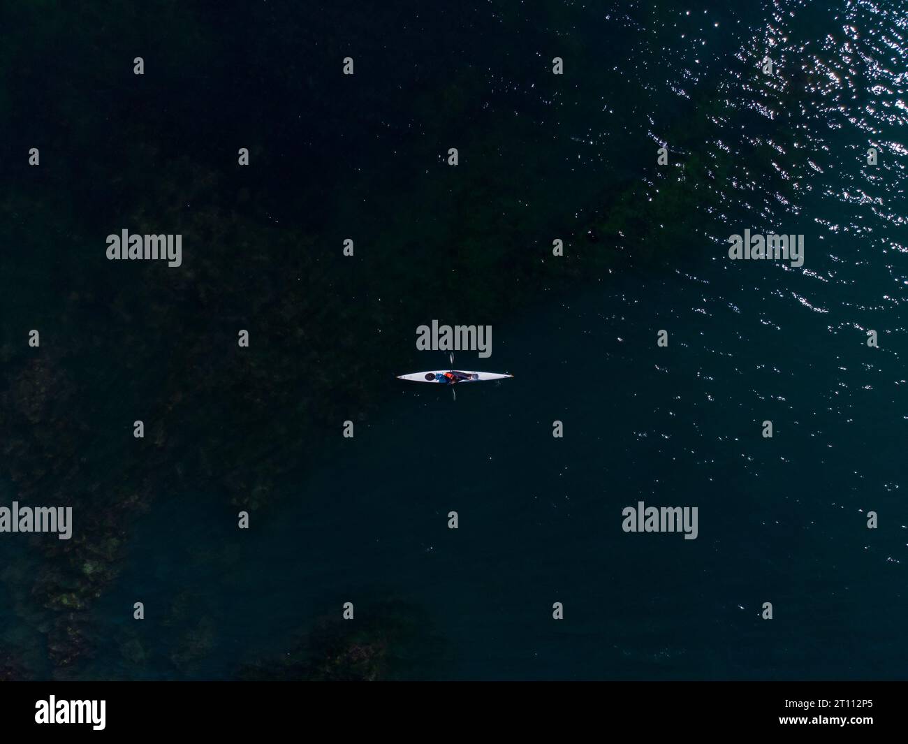 Aerial top view of a small group of people sea kayaking Stock Photo - Alamy