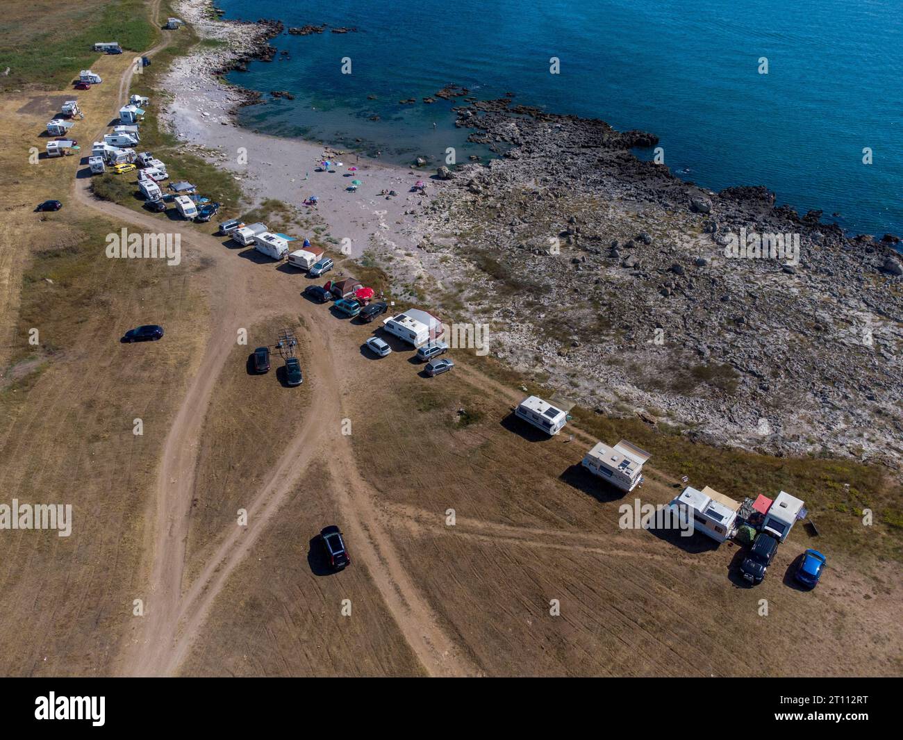 Aerial top view of caravan campers on the sea cost at sunny day, Black ...