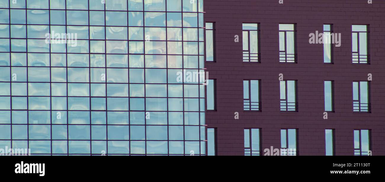 Exterior view of an office building wall with mirrored windows ...