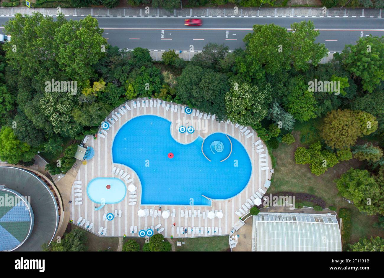 Aerial top view on swimming pool in hotel Stock Photo - Alamy