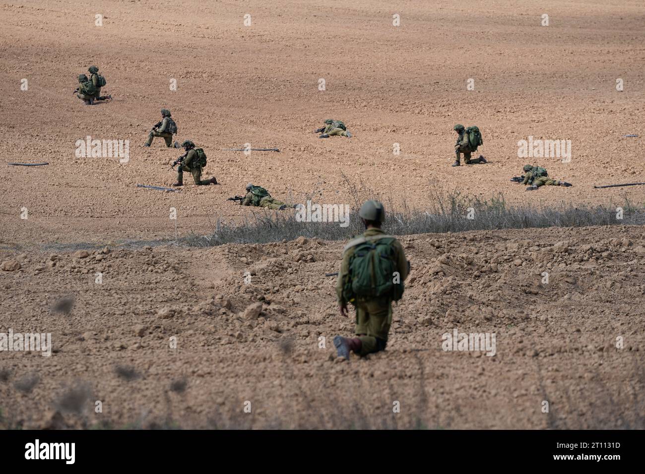 Israeli soldiers take positions near Kibbutz Kfar Azza on Tuesday, Oct ...