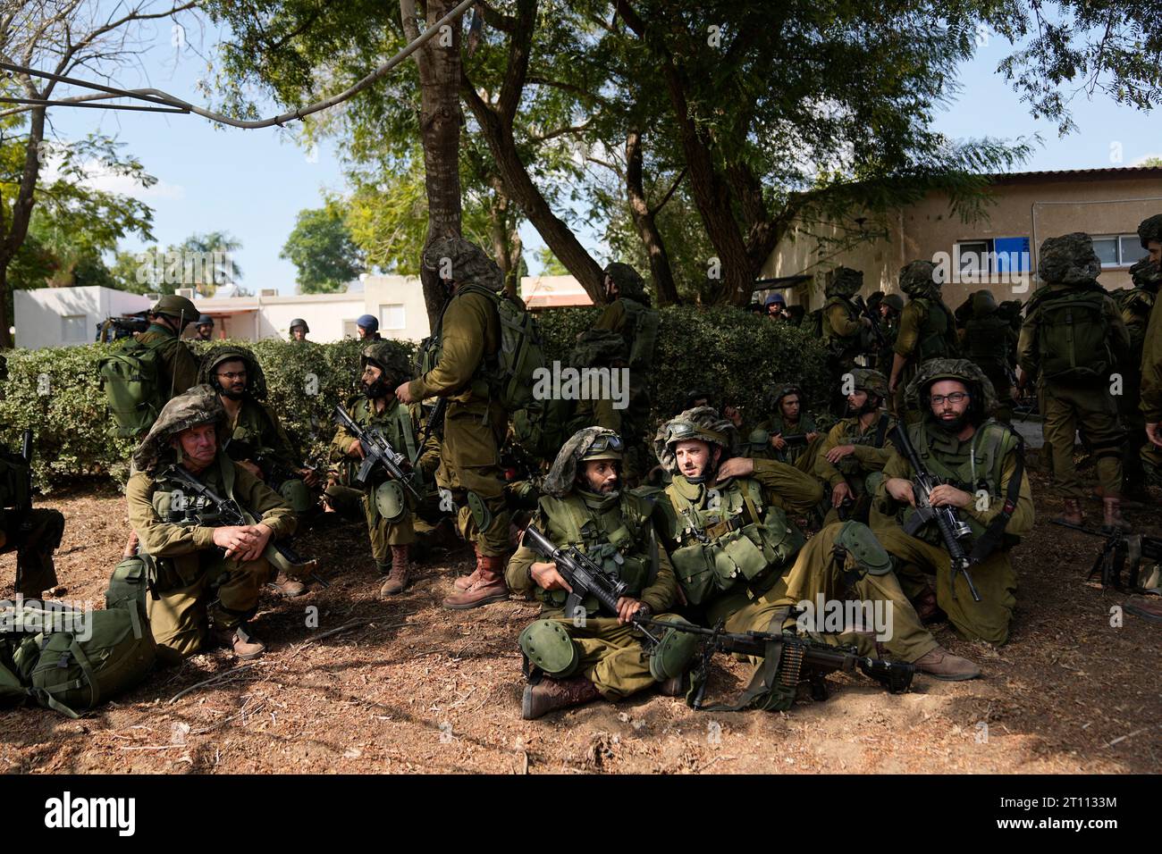 Israeli soldiers rest in kibbutz Kfar Azza on Tuesday, Oct. 10, 2023 ...