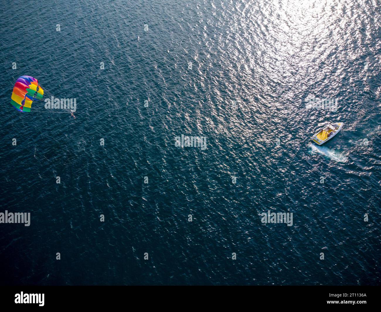Aerial top view of the boat and parachute in the sea resort Stock Photo ...