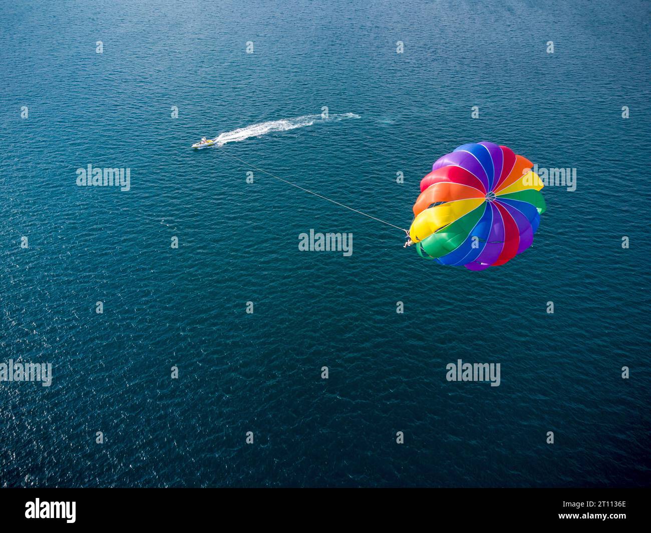 Aerial top view of the boat and parachute in the sea resort Stock Photo ...