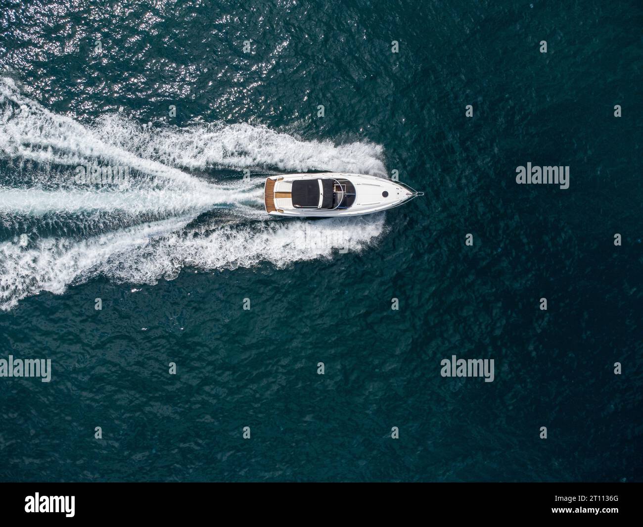 Aerial top down view of speed motor boat on open blue sea Stock Photo ...