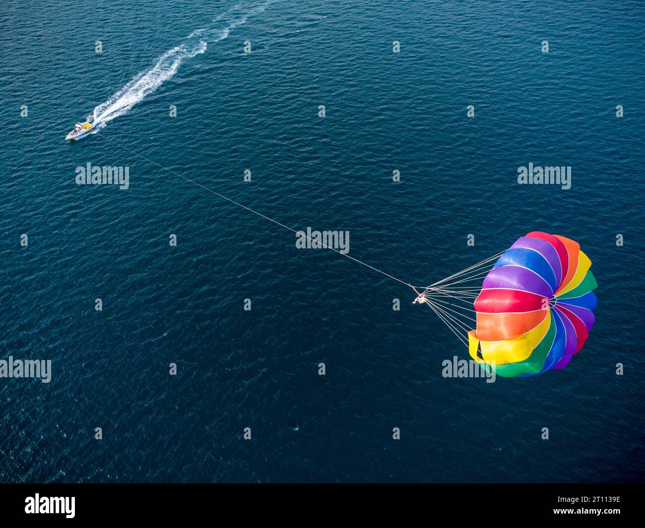 Aerial top view of the boat and parachute in the sea resort Stock Photo ...