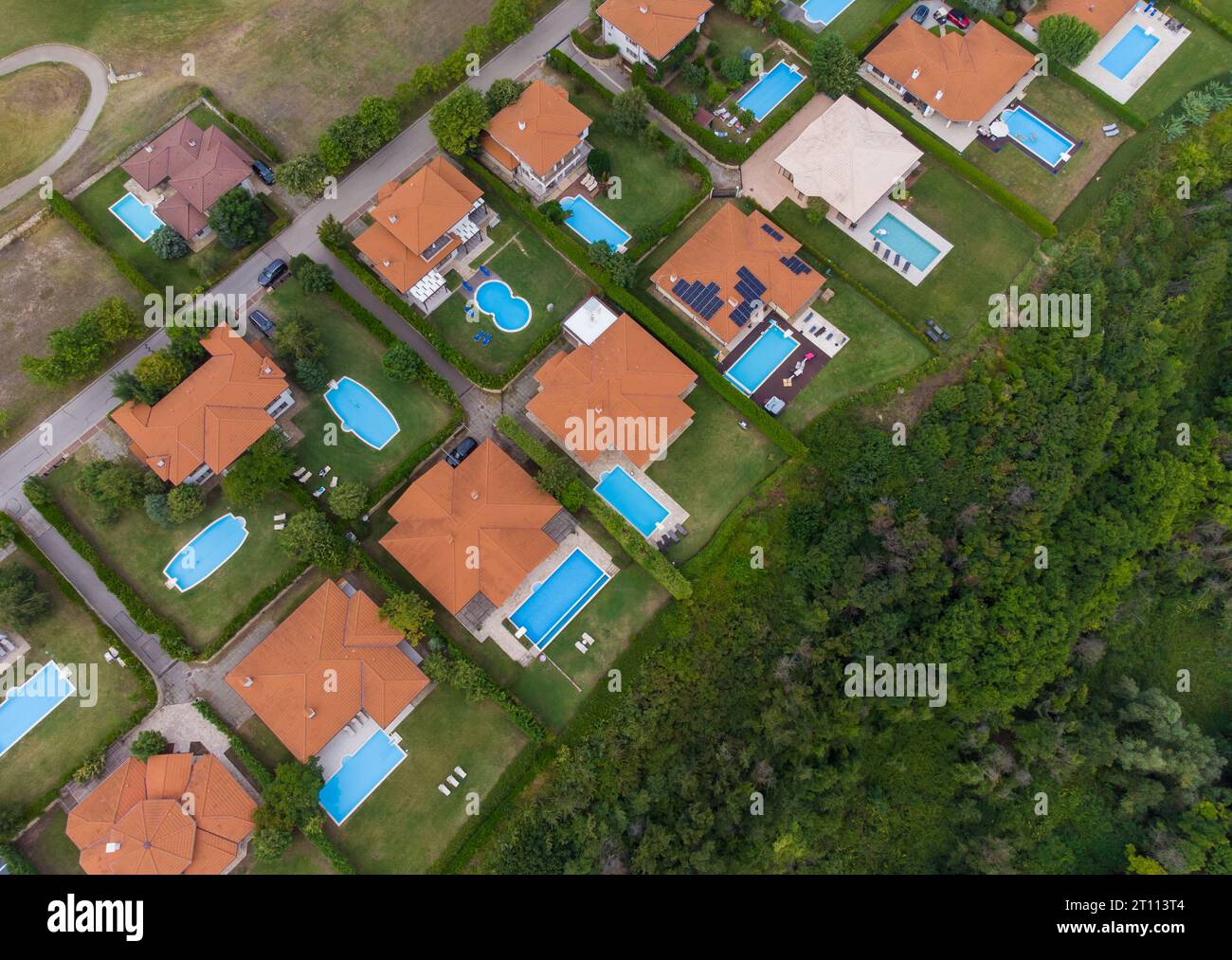 Modern cottage village with luxury houses, swimming pools and golf ...
