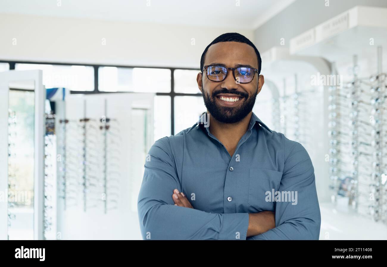 Eyeglasses, arms crossed and portrait of happy man, optician or ophthalmologist for vision help ...