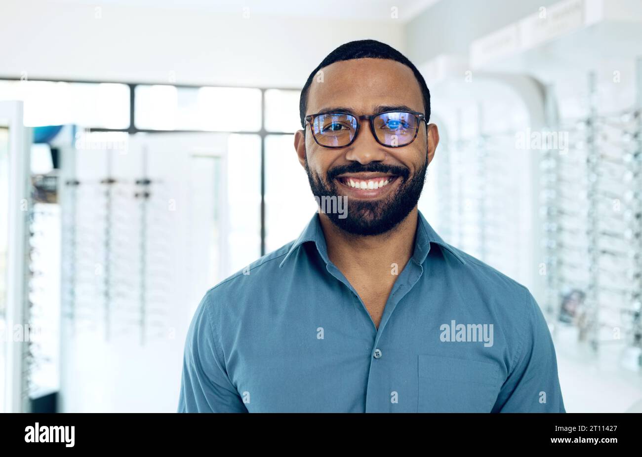 Glasses, optometrist smile and portrait black man for vision healthcare ...