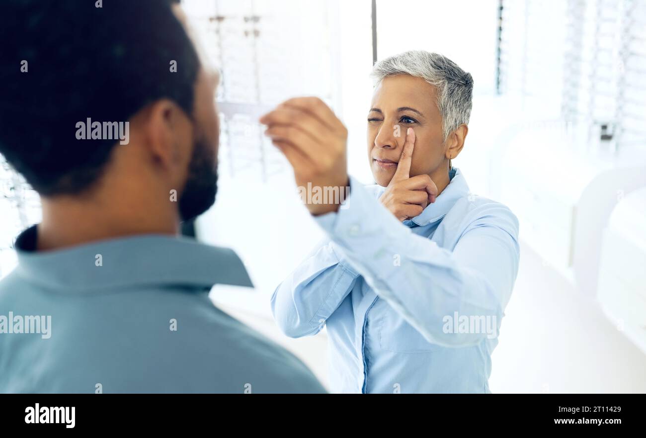Vision, eyes and medical test with a man at the optometrist for ...