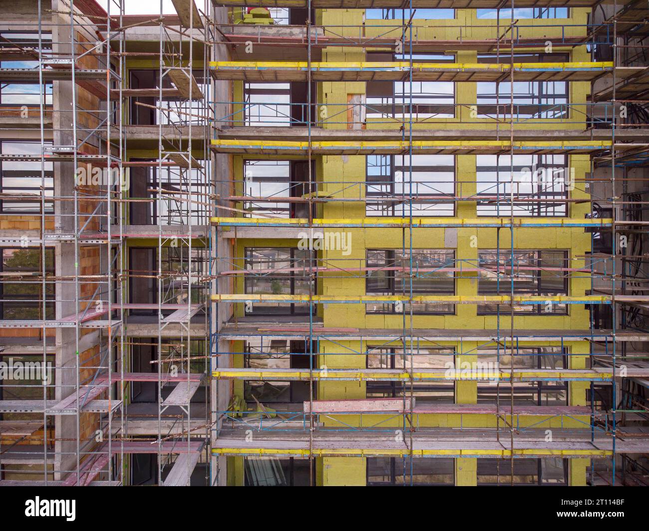 Scaffolding on apartment building consturction project, aerial view ...