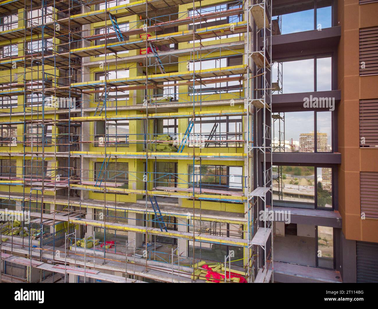Scaffolding on apartment building consturction project, aerial view ...