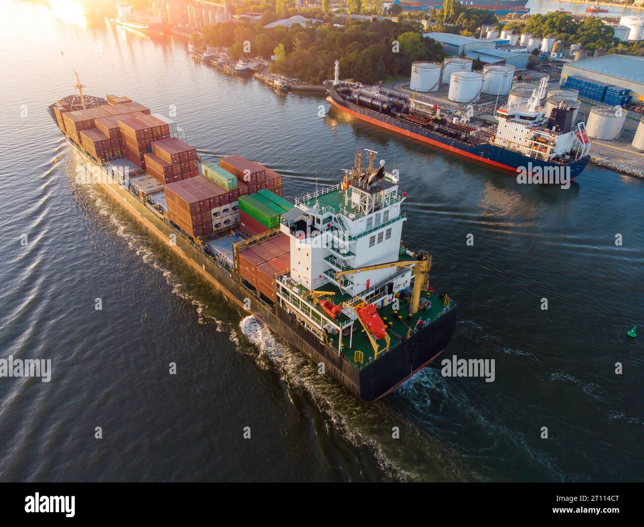 Aerial view of cargo container ship in the sea at sunset Stock Photo ...