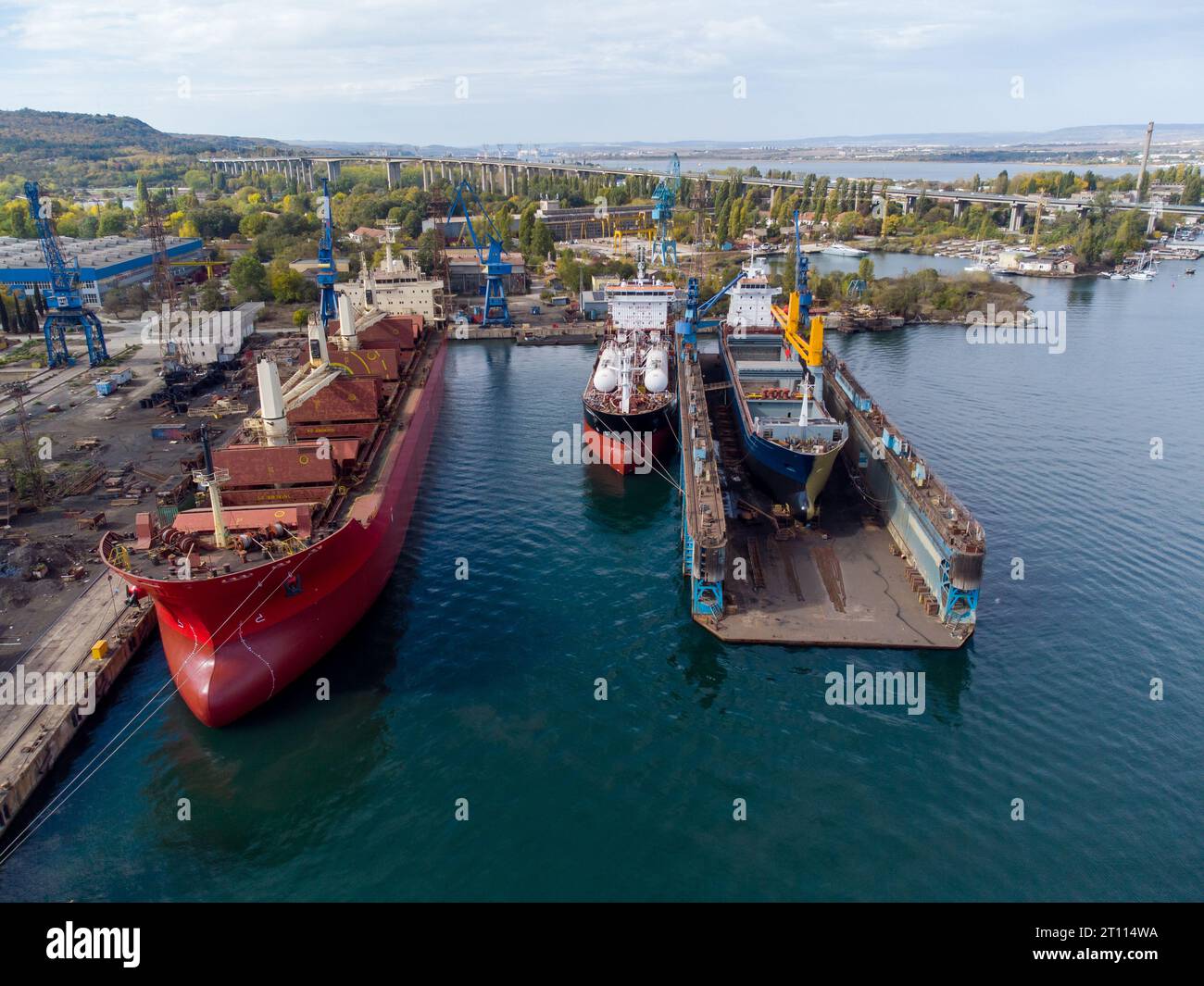 aerial top view shipyard dry dock maintenance and repair cargo ship ...