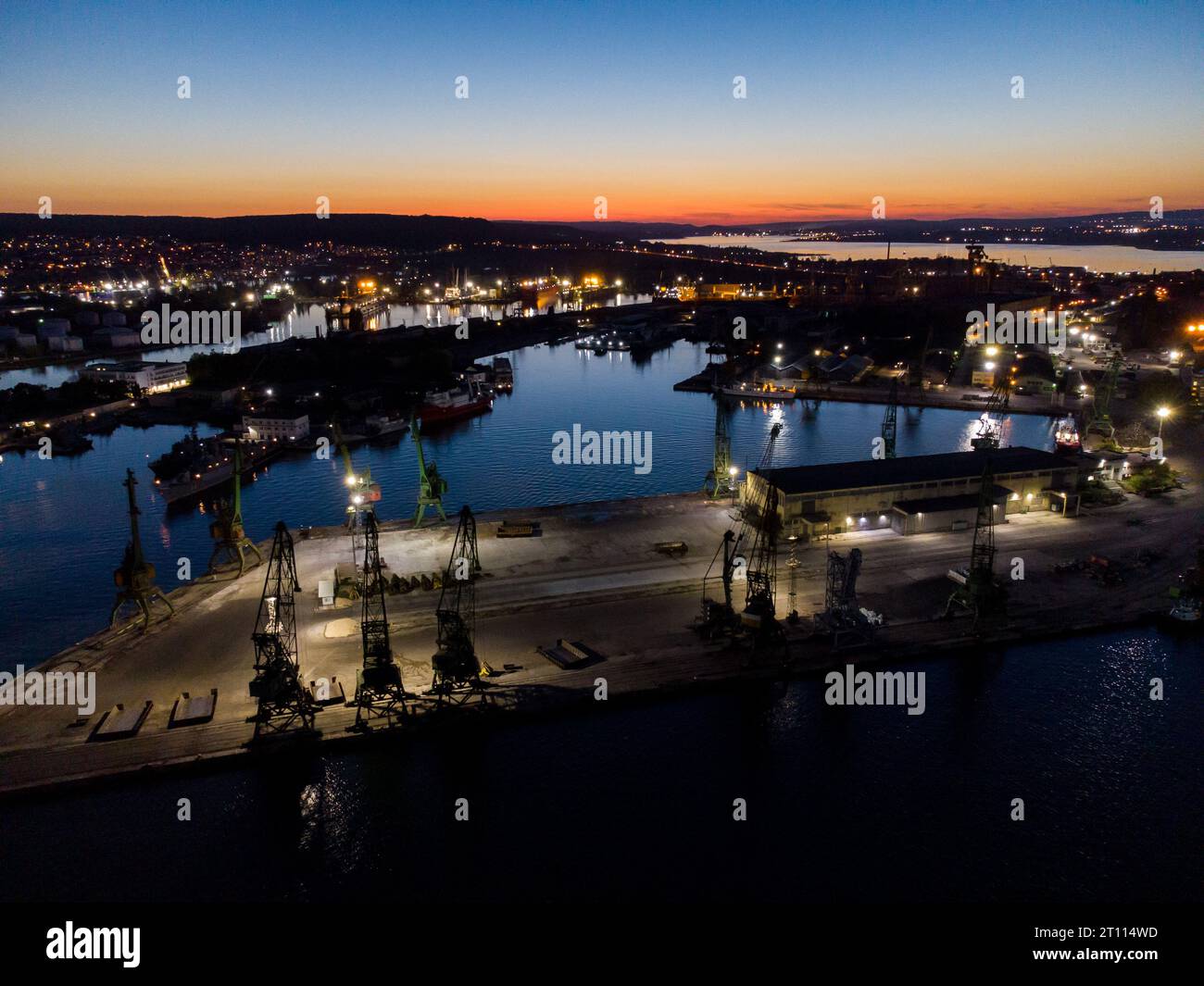 Aerial top view of cargo port with Cranes in Varna Bulgaria at night ...