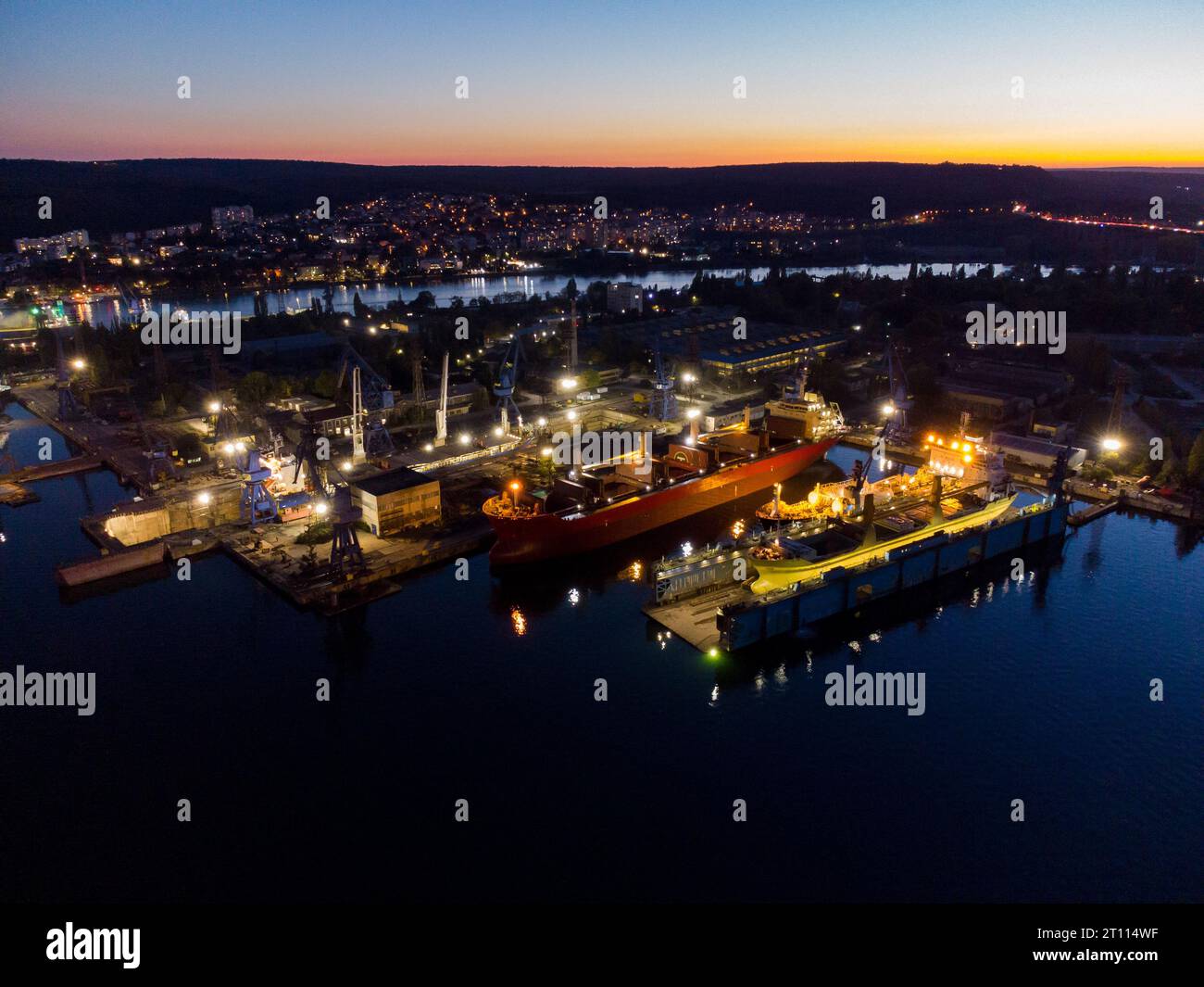 aerial top view shipyard dry dock maintenance and repair cargo ship ...