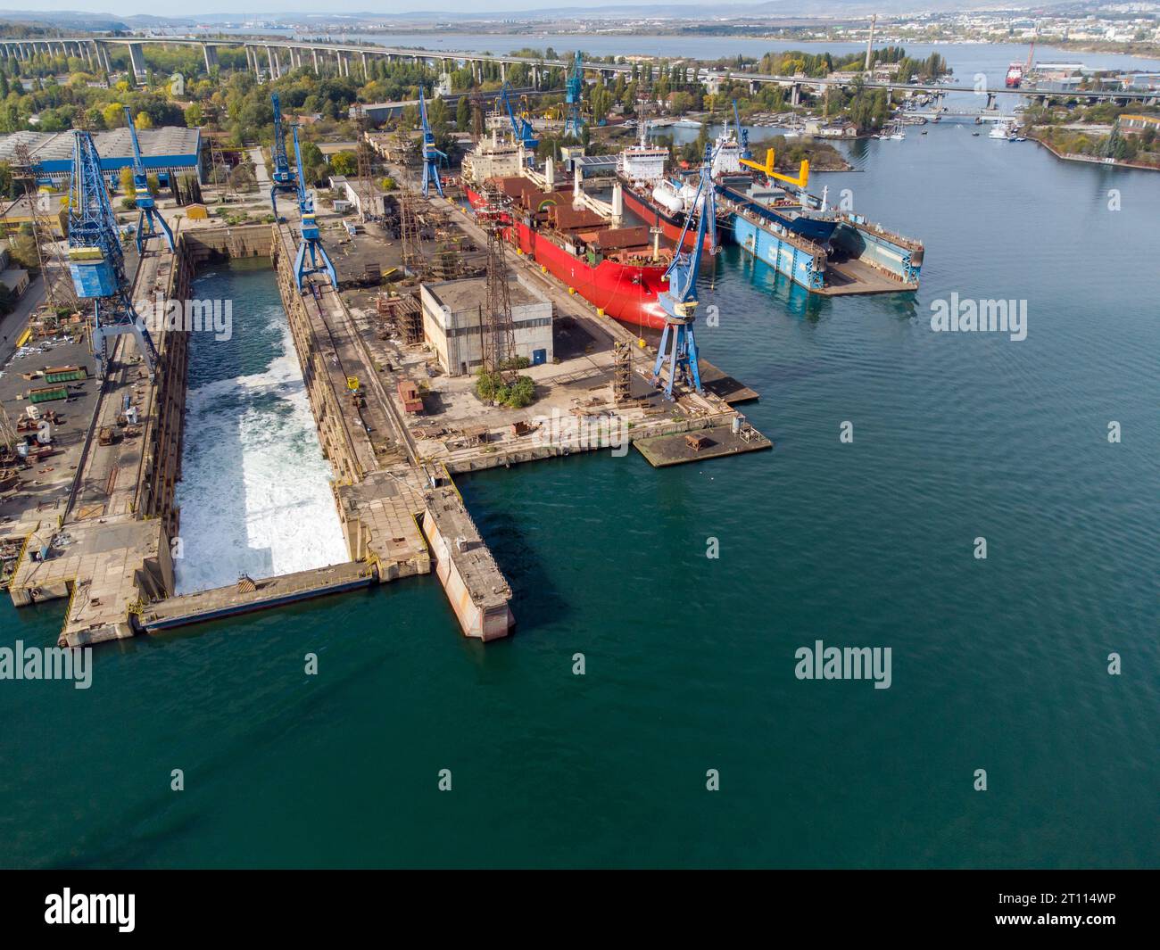 aerial top view shipyard dry dock maintenance and repair cargo ship ...
