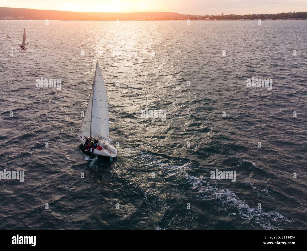 sailing yachts regatta race on sea aerial view at sunset Stock Photo ...