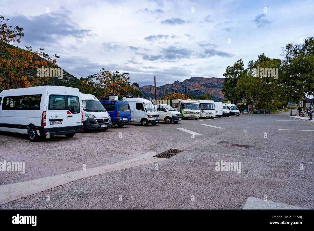 The parking lot by the beach in Leonidio is full of converted camper ...