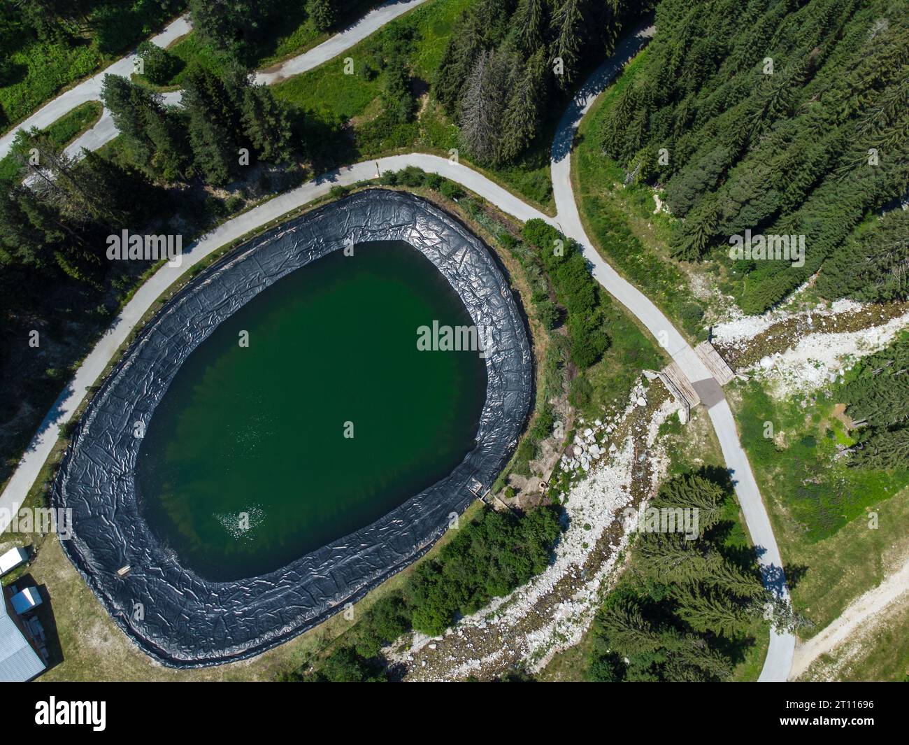 Aerial top down view of artificial lake or pond with plastic bottom ...