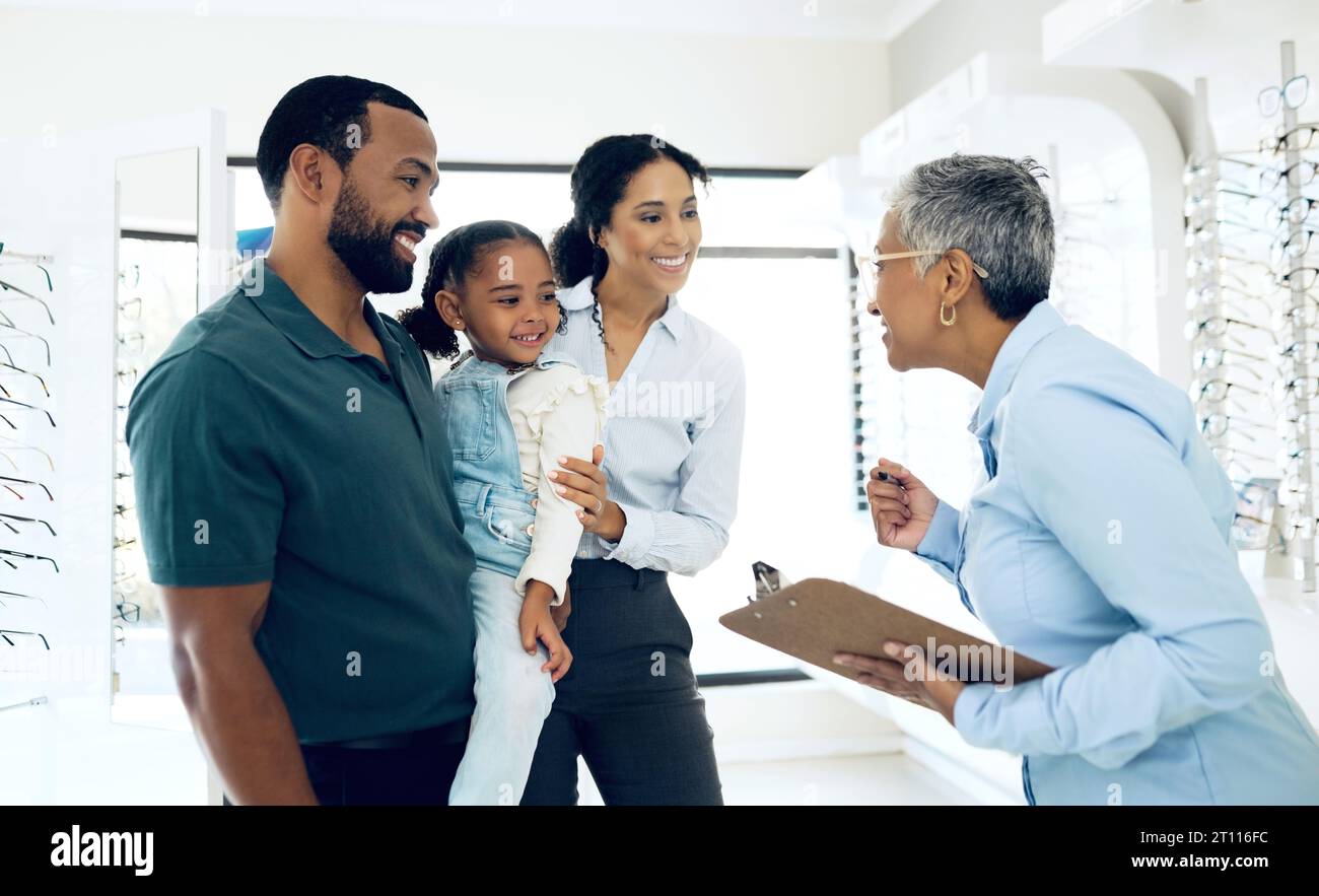 Family, optometry and eye care with a woman optometrist in a clinic to ...