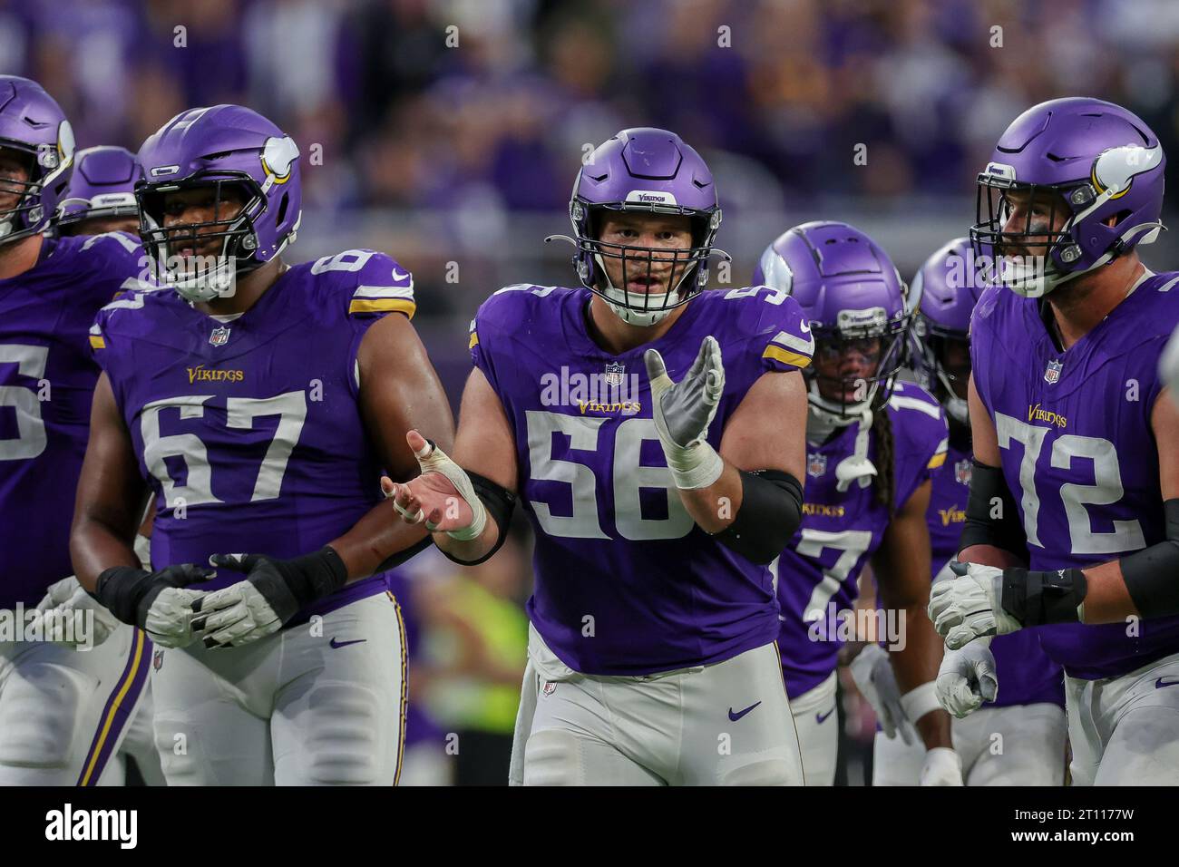Minnesota Vikings center Garrett Bradbury (56) huddles on the field ...