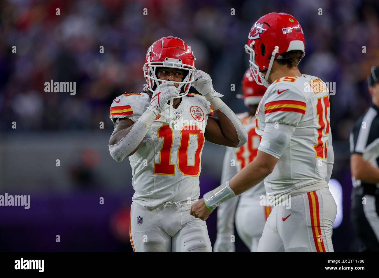 Kansas City Chiefs running back Isiah Pacheco (10) adjusts his helmet ...
