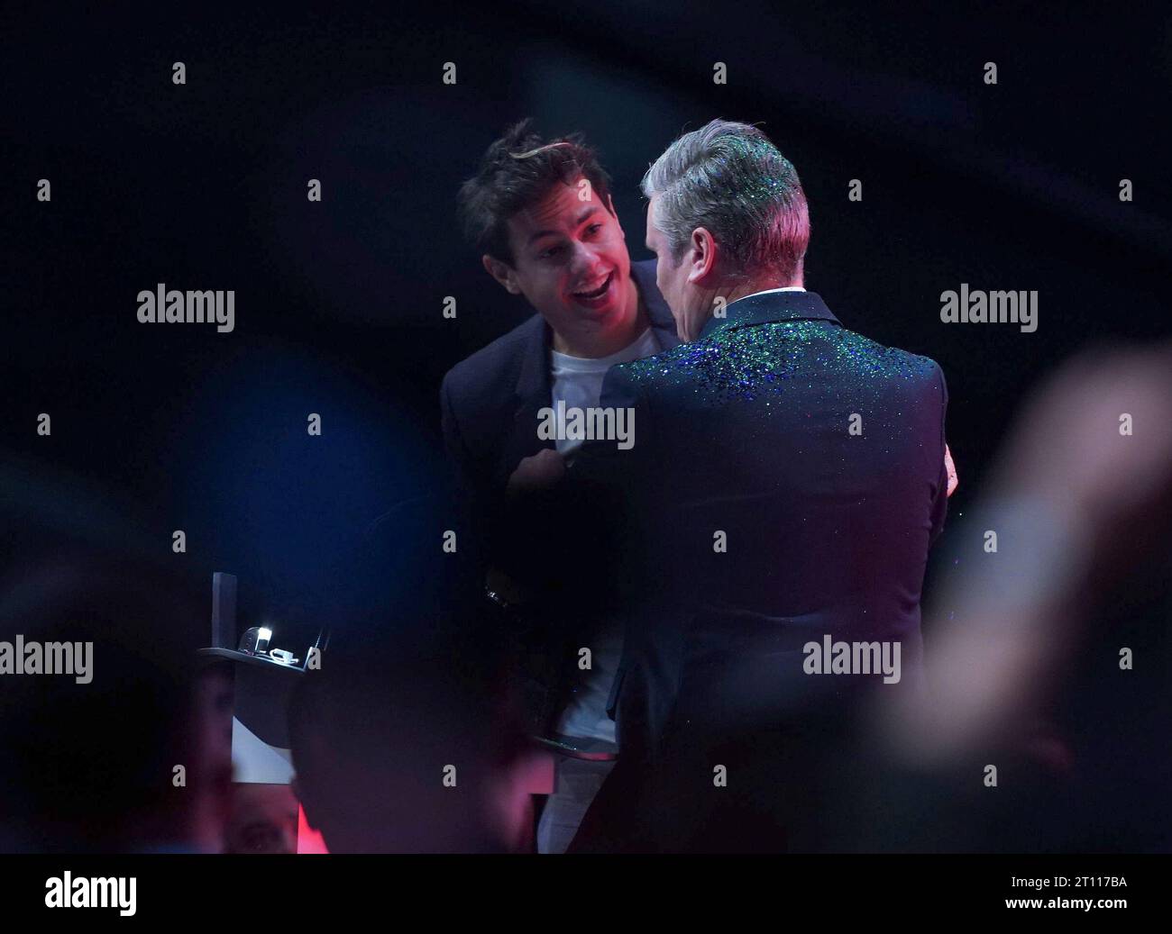 A protester throws glitter over and disrupts Labour leader Sir Keir ...