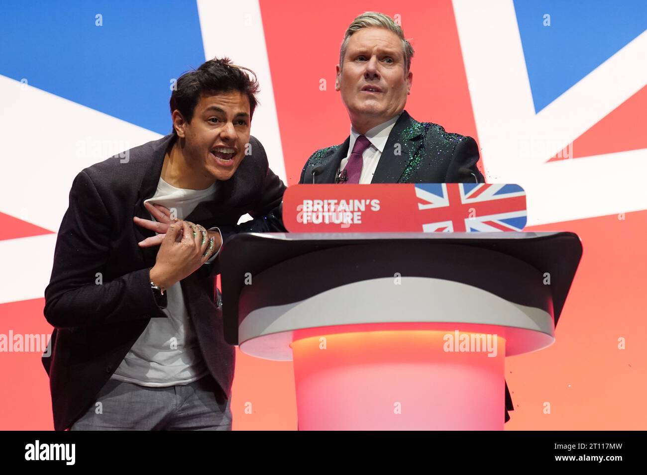 A protester throws glitter over and disrupts Labour leader Sir Keir ...