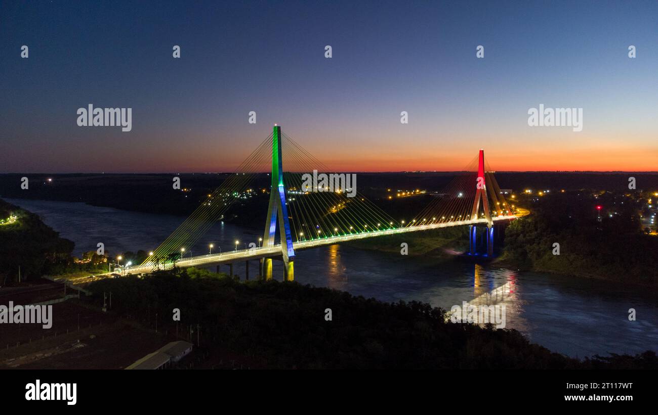 Illuminated cable-stayed bridge: Brazil-Paraguay Bridge at Night. High ...