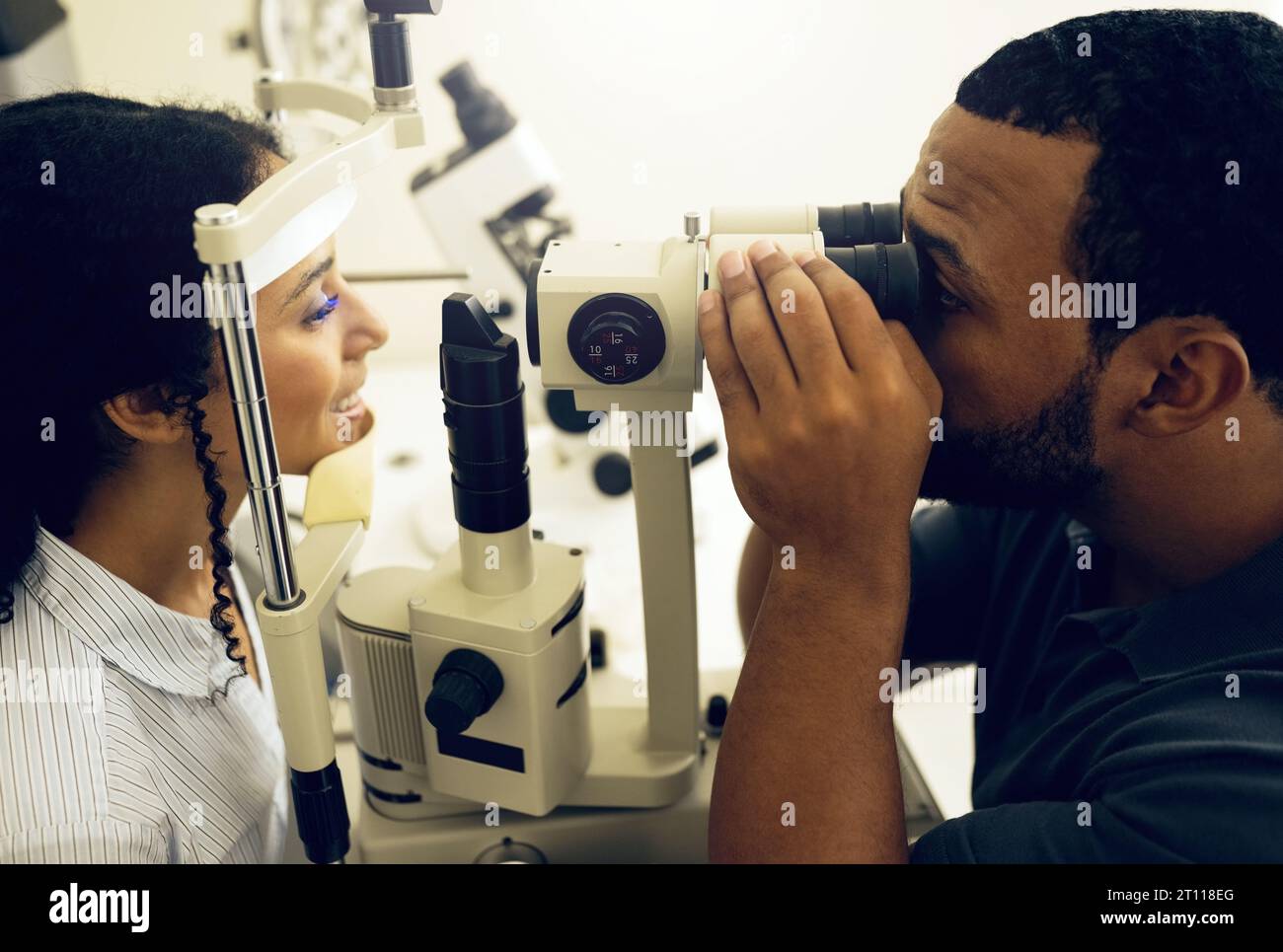 Eye test, machine and a woman with a doctor for a service, vision ...