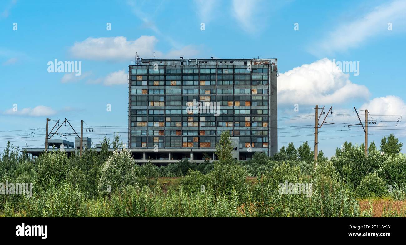 landscape of an industrial city outskirts with an old factory workshop ...