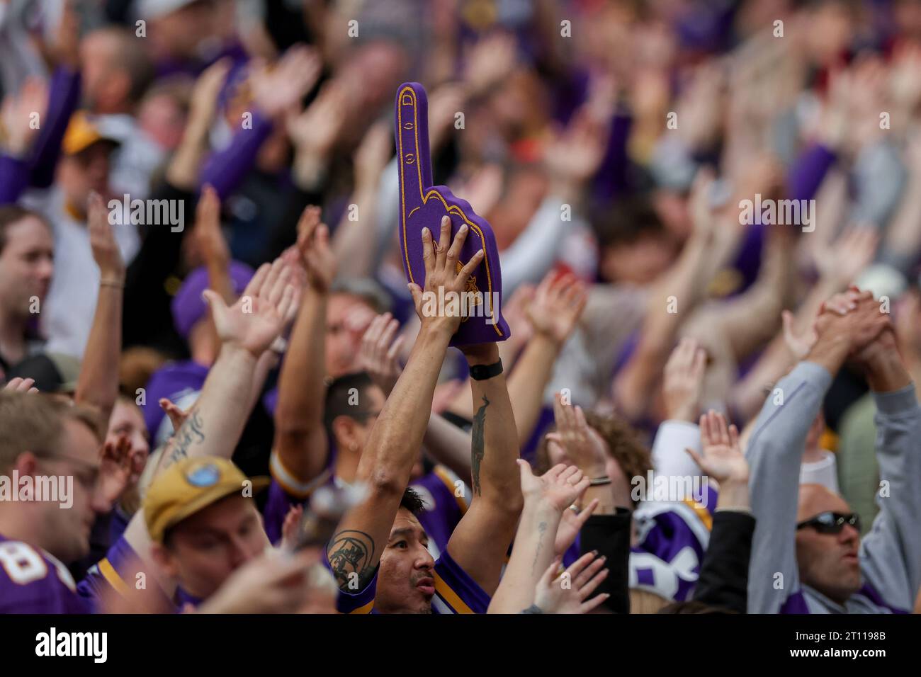 Football fans cheer as part of the Skol chant during the first half of ...