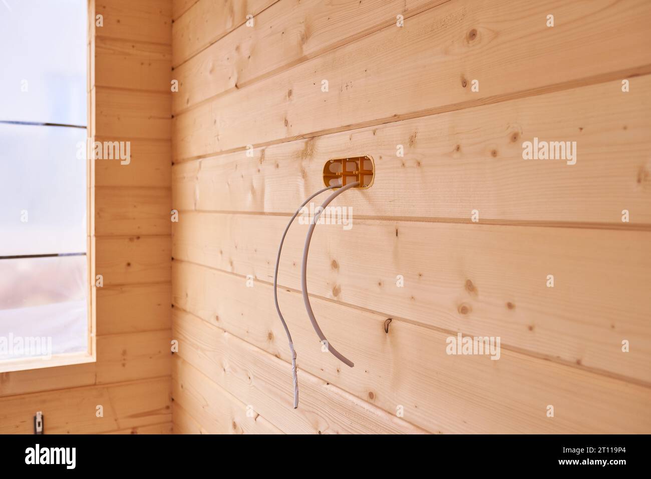 installation of electrical wiring inside a wooden house, nobody Stock ...