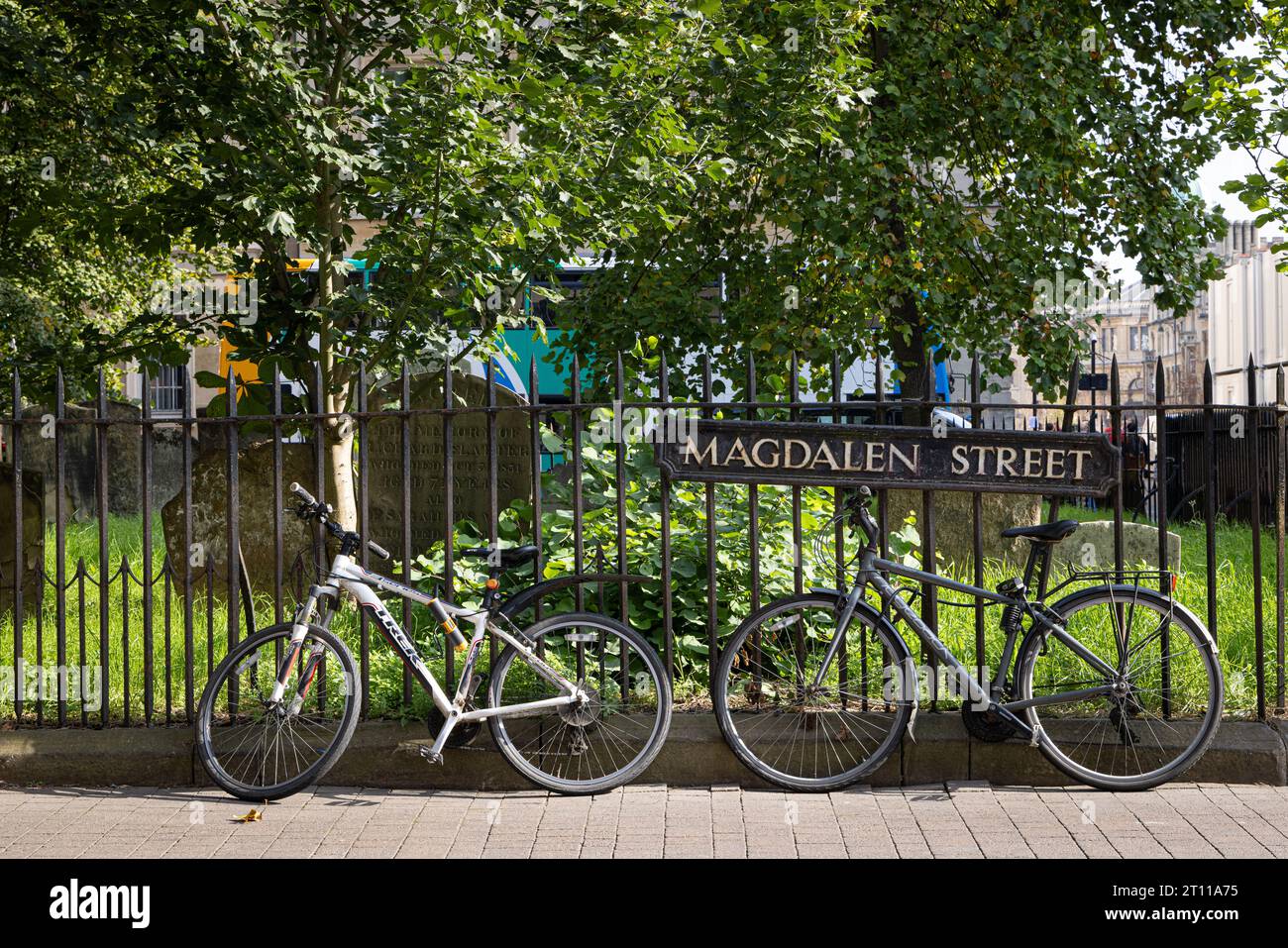 Bicycles against railings, Magdalen Street, Oxford City, Oxfordshire ...
