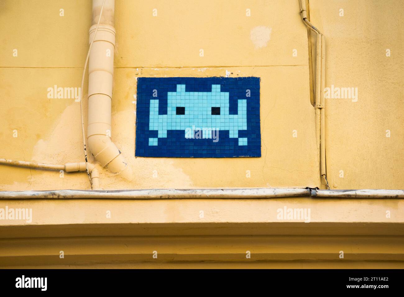 Wall mosaic of a Space Invader character from the famous video game ...