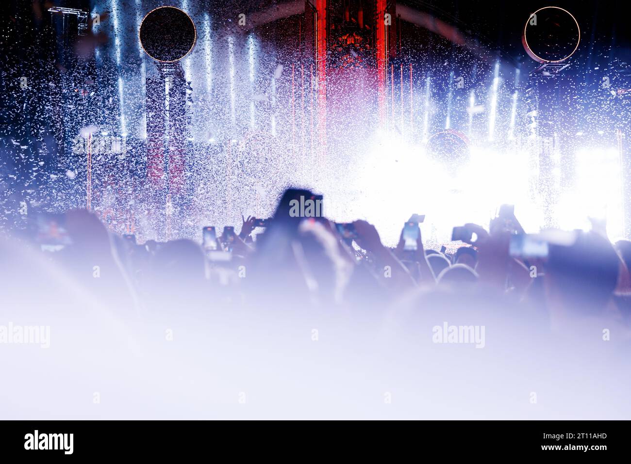 People crowd on a dance floor during a concert with a light show Stock ...