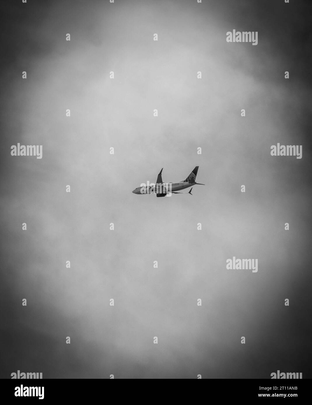 airplane through the sky to its next destination Stock Photo - Alamy