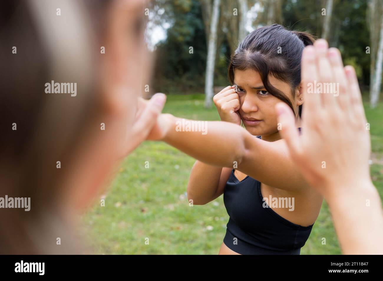 Young female boxer training outdoors. Boxing sparring and punching workout Stock Photo - Alamy