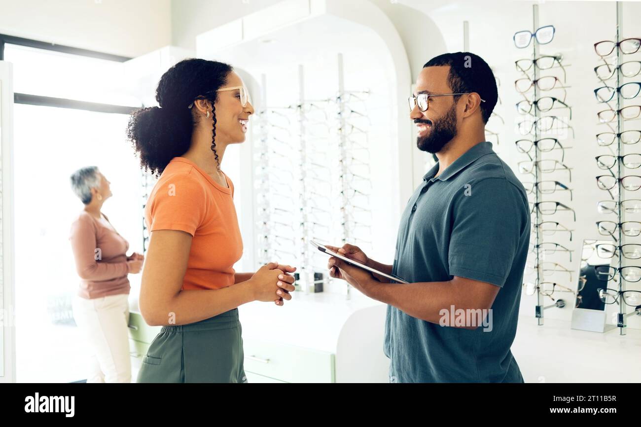 Optometry, glasses choice and tablet with inventory list in store ...