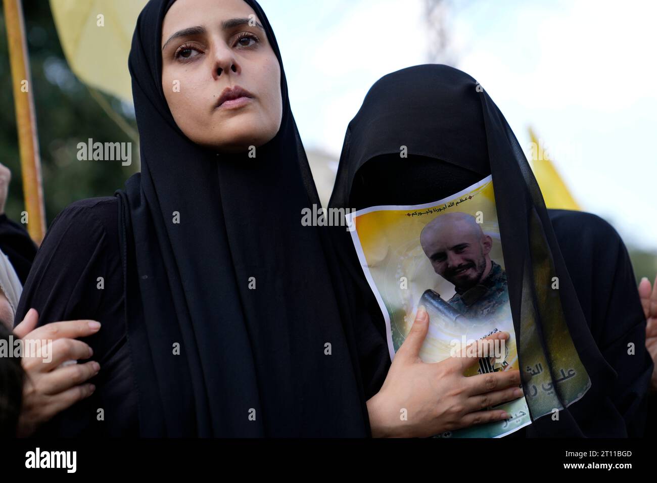 From left, the wife and the sister of Hezbollah fighter Ali Ftouni who ...