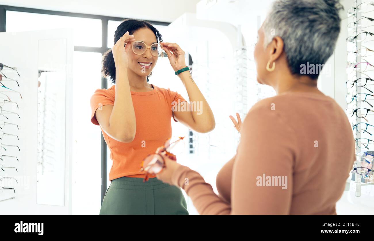 Optometry, customer with women and glasses choice in store, health and insurance with ...
