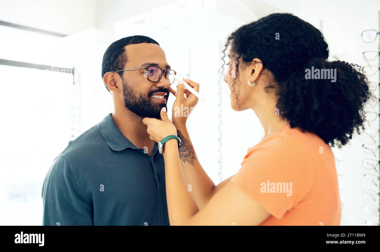 Man, woman optometrist and glasses fitting in store with prescription ...