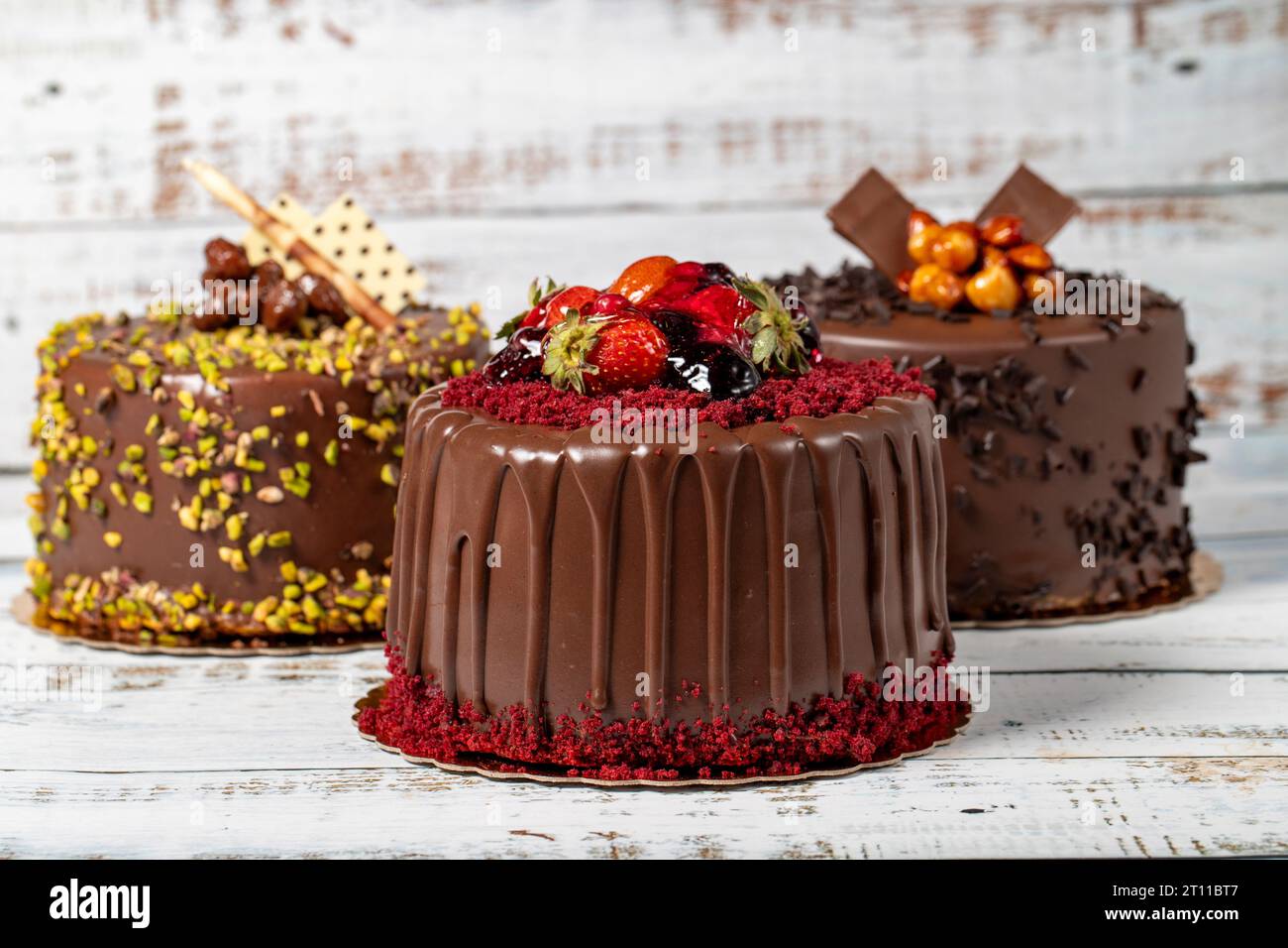 Varieties of chocolate cake. Various birthday cakes on wooden ...