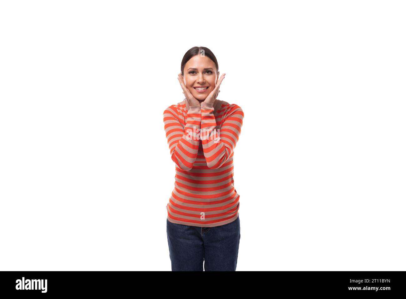 young smiling european slim woman dressed in a casual orange sweater ...