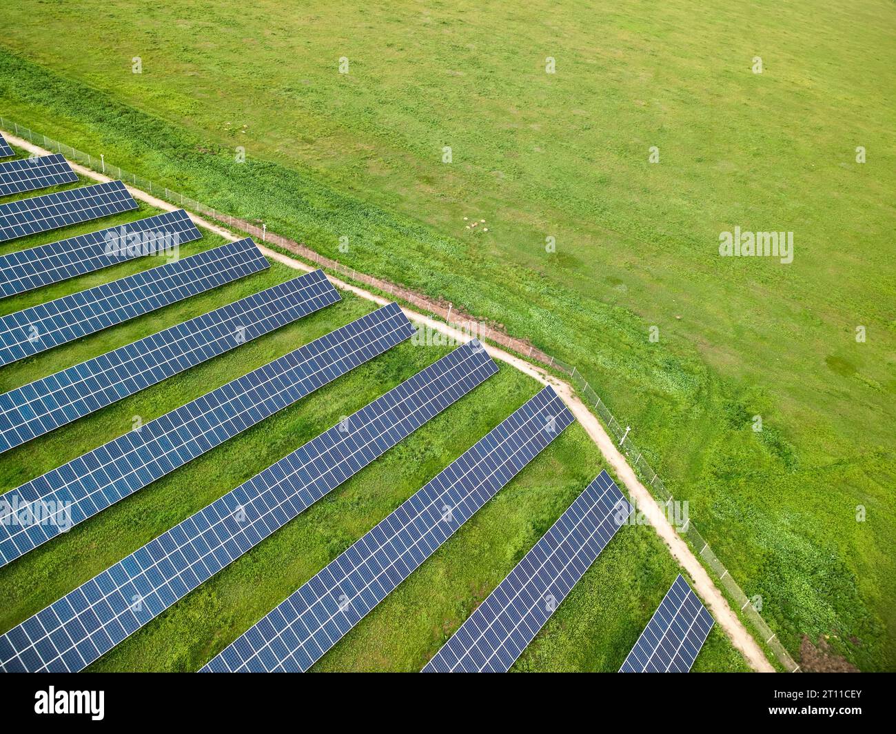 Aerial view of solar power plant in green meadow at sunny day Stock ...