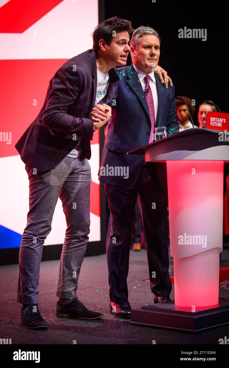 London, UK. 10 October 2023. A protester throws glitter over Labour ...