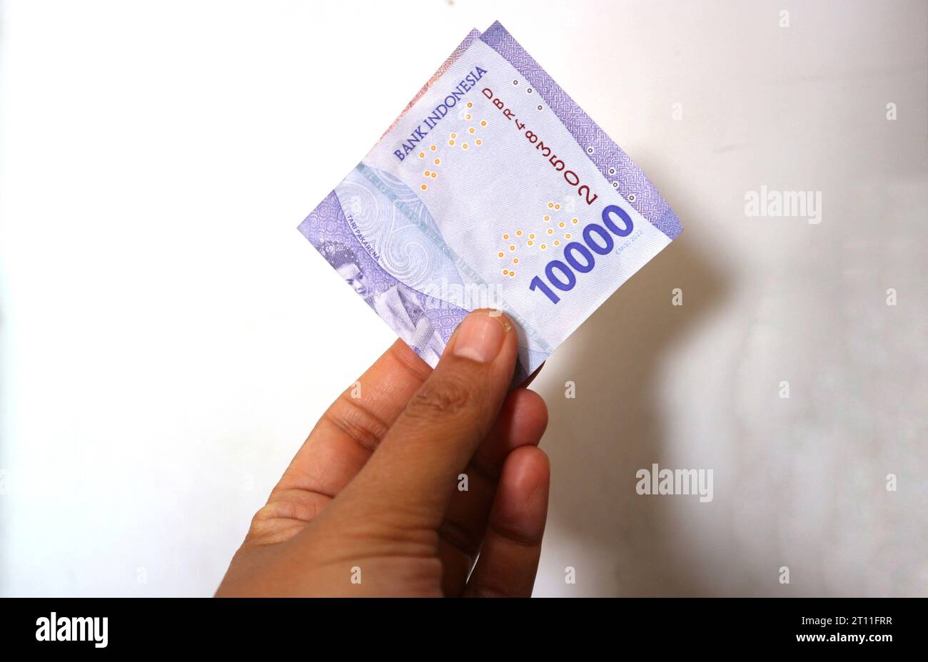 Indonesian 10000 rupiah currency note hi-res stock photography and ...