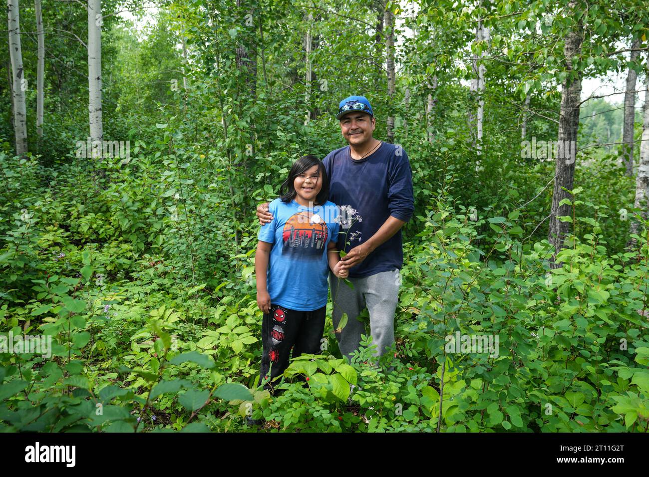 Ryan Moonias stands with his nine year old son Ryland in Neskantaga ...