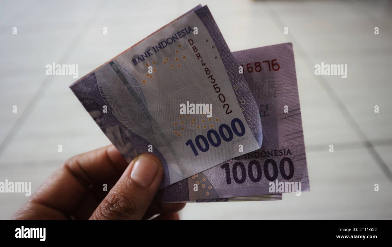 Batu City, East Java, Indonesia . October 20 ,2023 : man holding ...